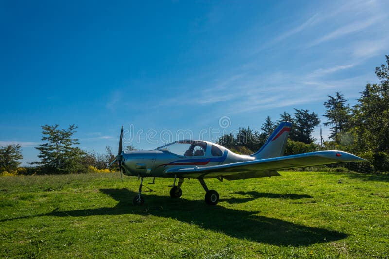 A Single-engine Plane on a Small Field, Abkhazia. Stock Photo - Image ...