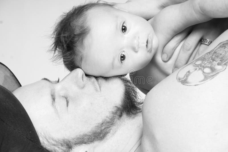 Single Father Sitting on Grass with Little Daughter. Stock Photo ...