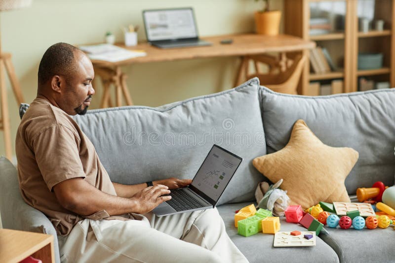 Single Father Working from Home and Using Laptop Stock Photo - Image of ...