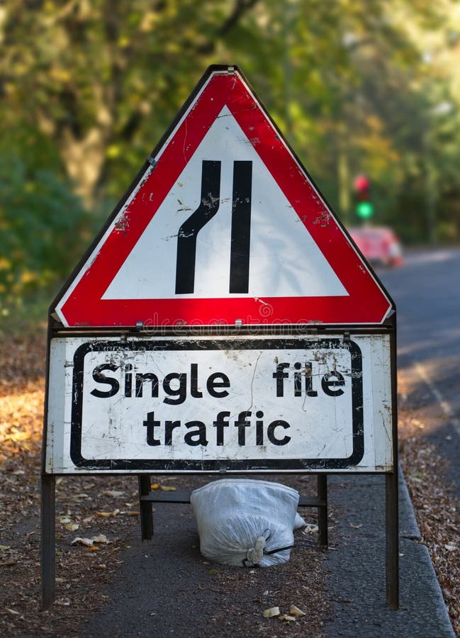 Single File Traffic Road Sign Indicating that the Road Narrows from the ...