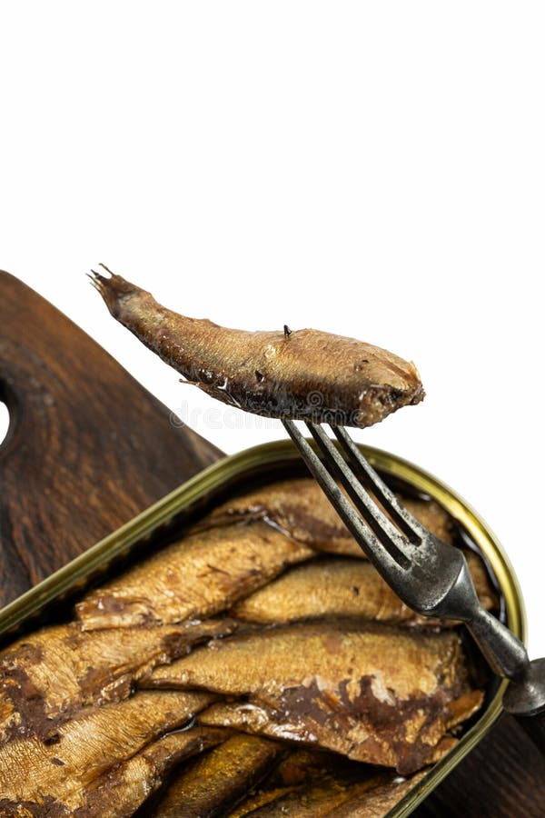 A Single Fish is Presented on a Fork Above an Open Can, Showcasing the ...