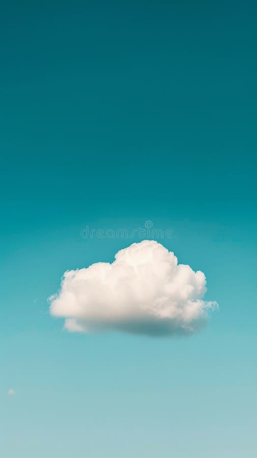 A Single Fluffy White Cloud Set Against a Bright Blue Sky Stock Photo ...