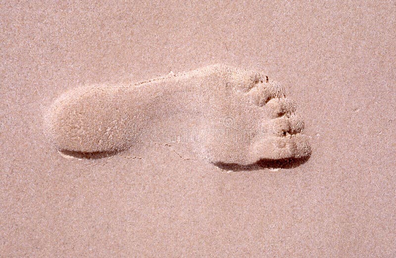 Single Footprint of a Bare Foot Left in the Sand on a Beach Stock Photo ...