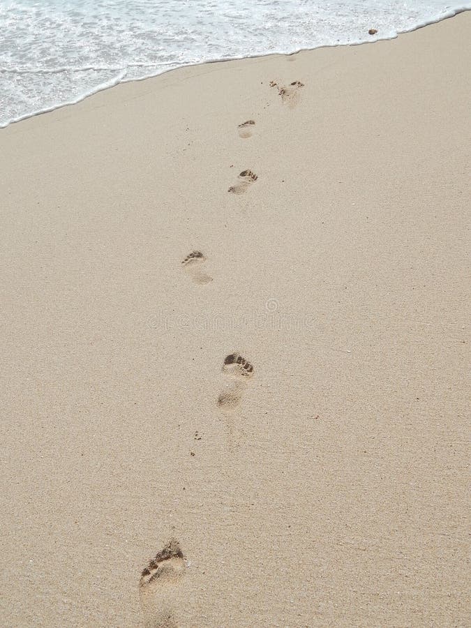 Single Footprints on the Beach Stock Photo - Image of serene, alone ...