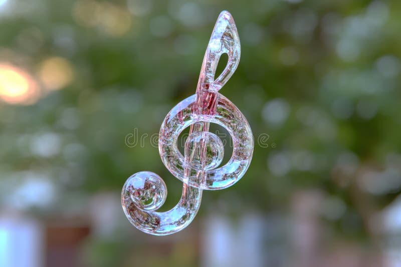 A Single Glass Musical Note Hangs from a String, Ready To Be Played ...