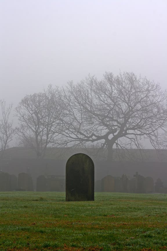 Single Gravestone in a Spooky Graveyard Stock Photo - Image of ...
