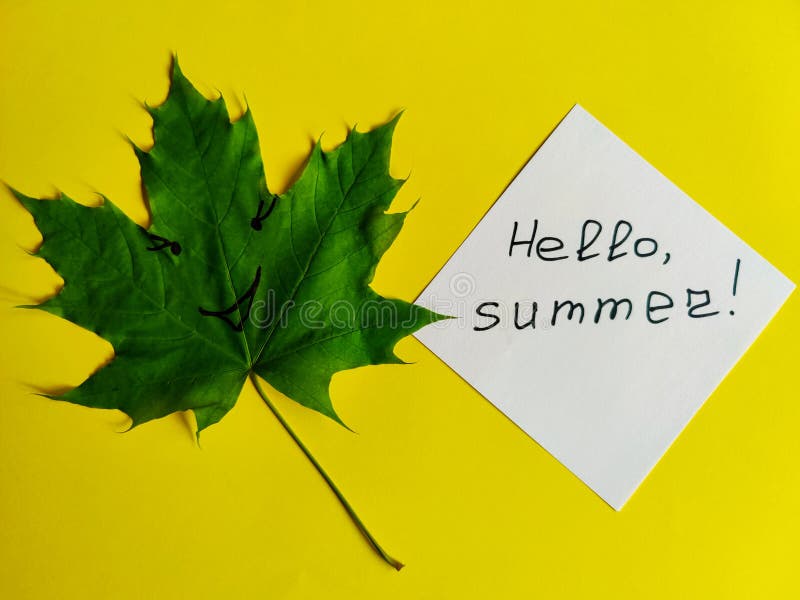 Single Green Maple Leaf and White Sheet of Paper with the Inscription ...
