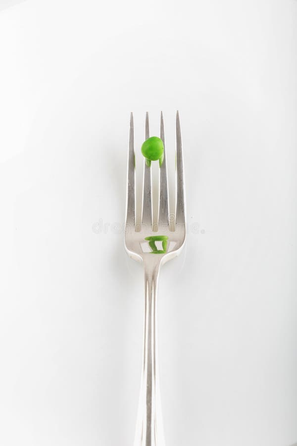 A Single Green Pea on a Silver Fork Stock Image - Image of tableware ...