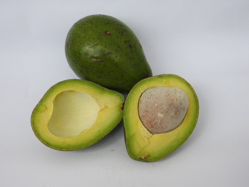 Single and Group of Butter Fruit Full and Half Sliced and Holding Fruit ...