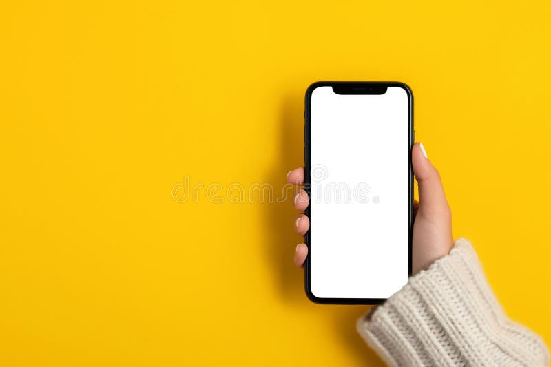 Single Hand Holding Smartphone with Yellow Background Stock Photo ...