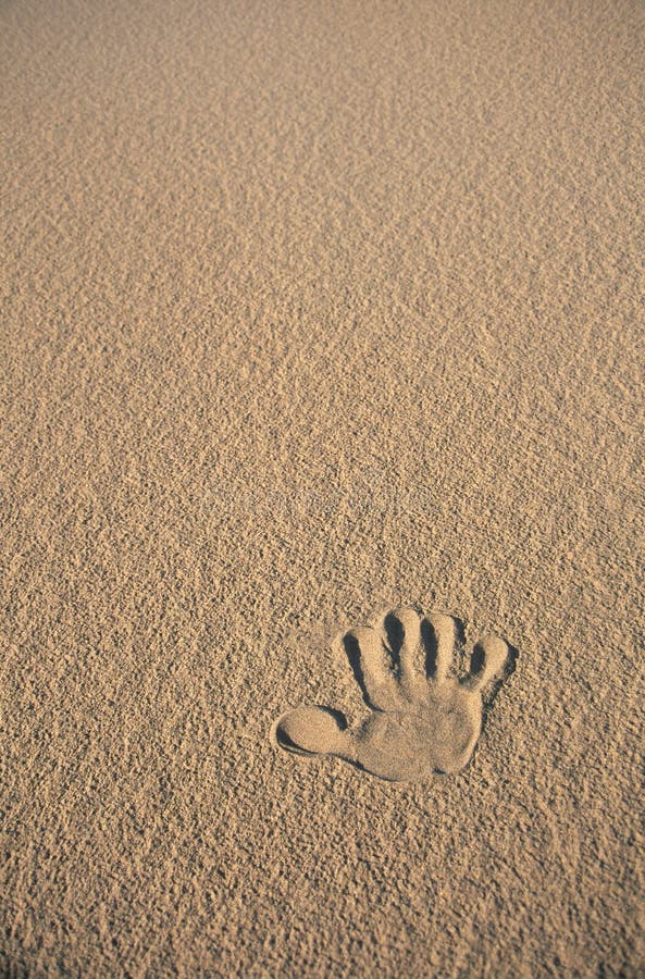 Single Hand Print in Beige Sand Stock Photo - Image of singular ...