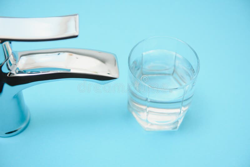 Single Handle Water Tap on Light Blue Background. New Chrome or Steel ...