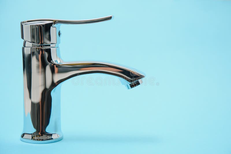 Single Handle Water Tap on Light Blue Background. New Chrome or Steel ...