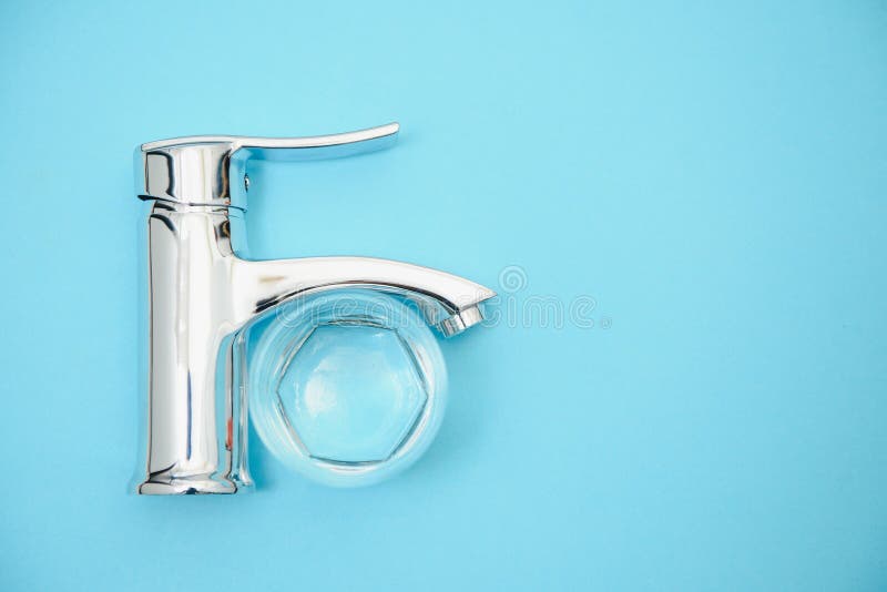 Single Handle Water Tap on Light Blue Background. New Chrome or Steel ...