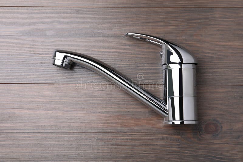 Single Handle Water Tap on Wooden Table, Top View Stock Image - Image ...