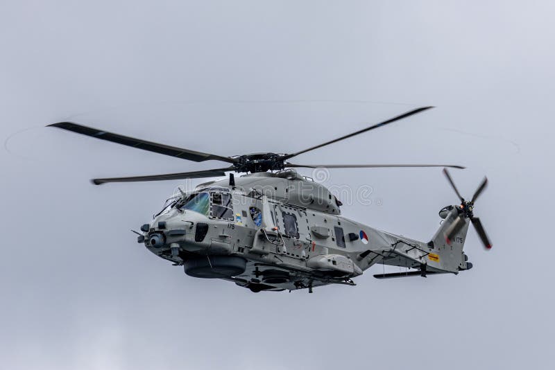 Single Helicopter in Mid-flight Against a Cloudy Sky. Editorial ...