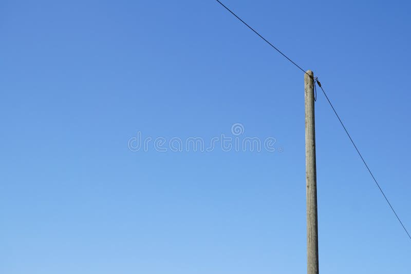 A Single High Voltage Power Line Against Blue Cloudless Sky. Overhead ...