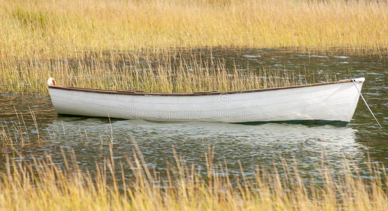 Small row boat in the cove stock photo. Image of natures - 307295402
