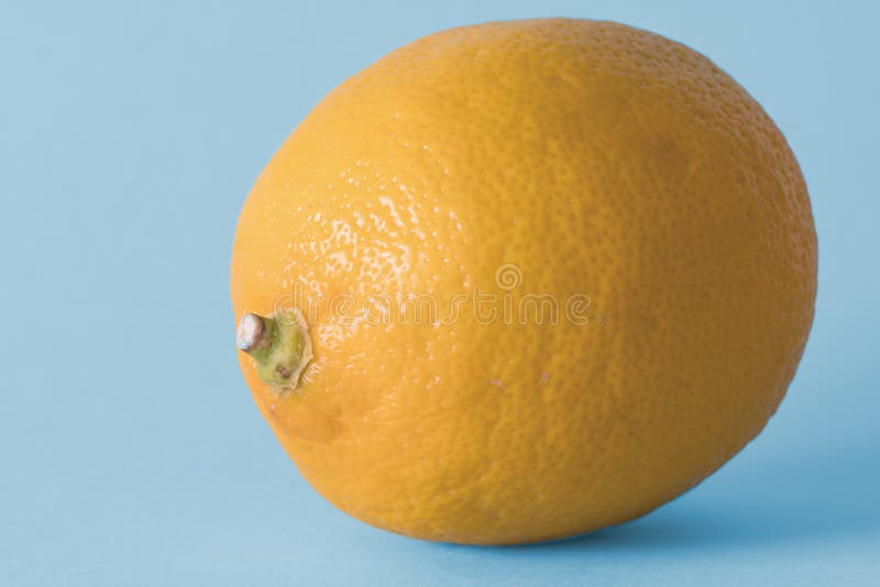 Single Lemon on a Blue Background Stock Photo - Image of single, food ...
