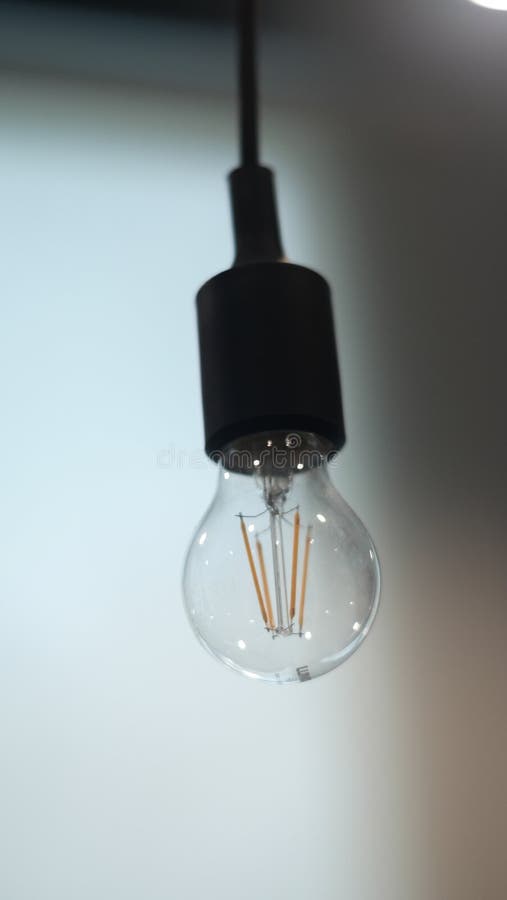 A Single Light Off Hanged Down Lamp in the Office Stock Image - Image ...