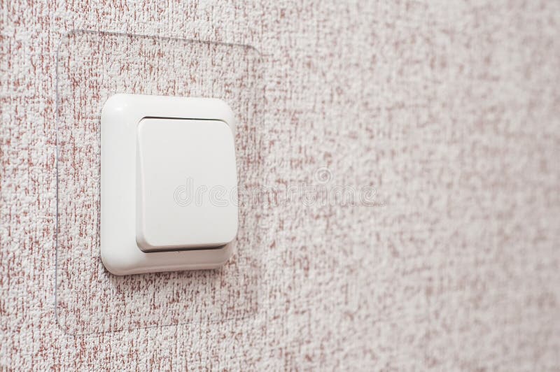 Single Light Switch on the Wall Covered with Wallpaper Stock Image ...