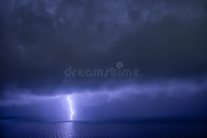 Single Linear Lightning Over the Sea Stock Photo - Image of beautiful ...