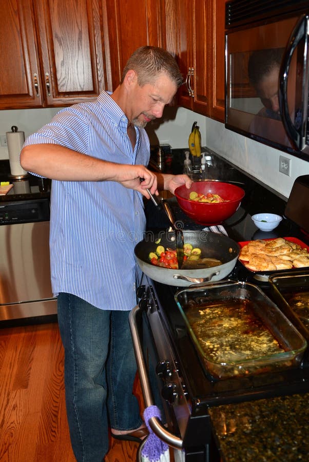 Single man cooking editorial stock image. Image of single - 60106309