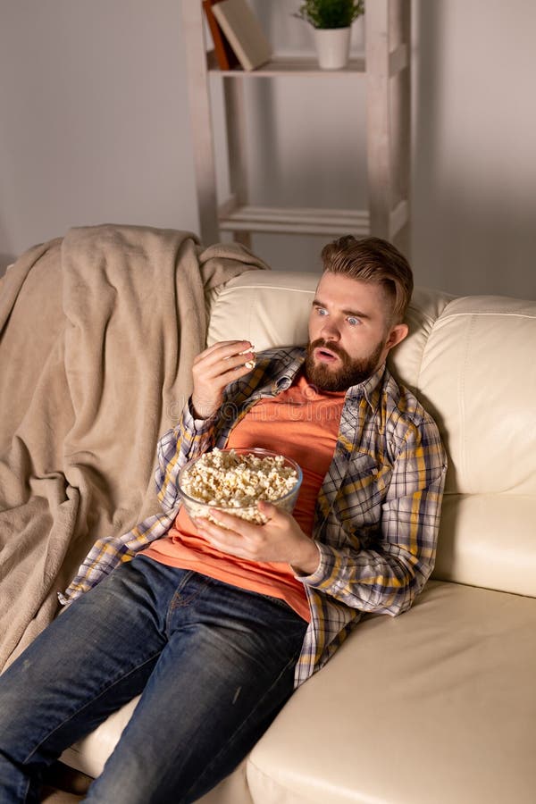 Single Man on the Couch Watching TV Stock Photo - Image of leisure ...
