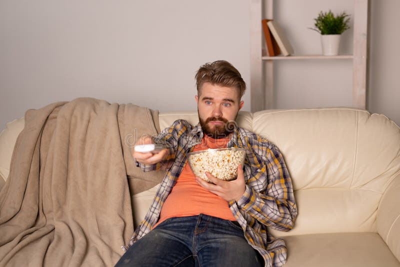 Single Man on the Couch Watching TV Stock Image - Image of people ...