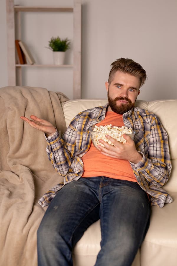 Single Man on the Couch Watching TV Stock Image - Image of relax ...
