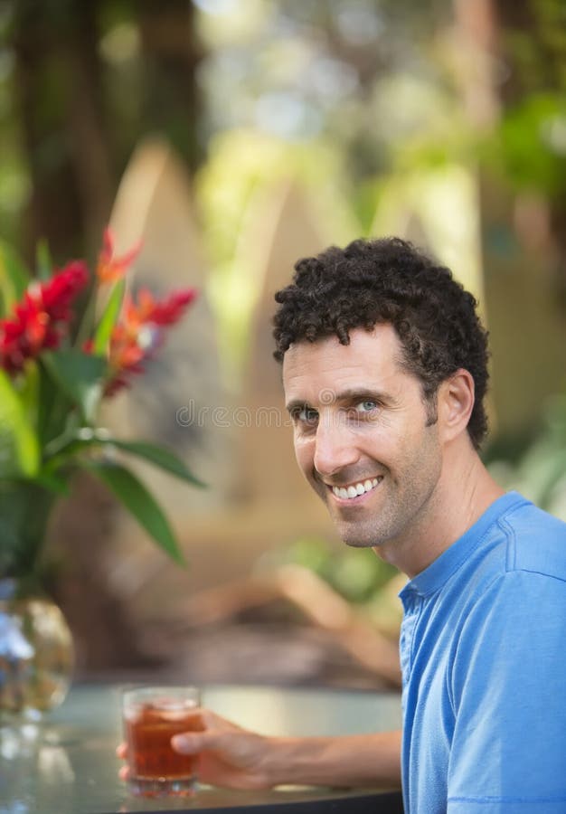 Single Man with Drink Outdoors Stock Image - Image of smiling, alcohol ...
