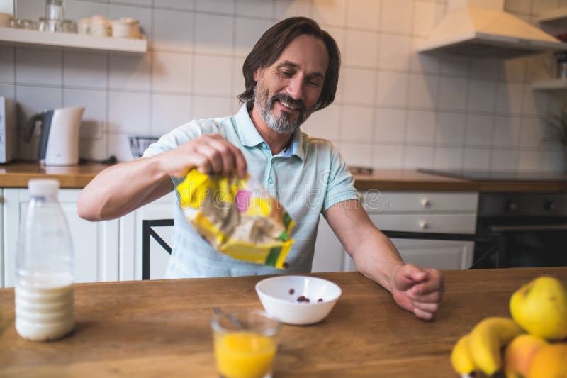 Single Man Having Breakfast in the Kitchen at Home Stock Photo - Image ...