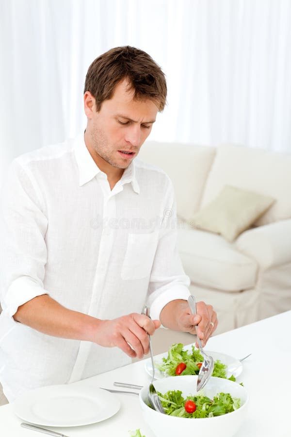 Single Man Serving Salad Standing at a Table Stock Image - Image of ...