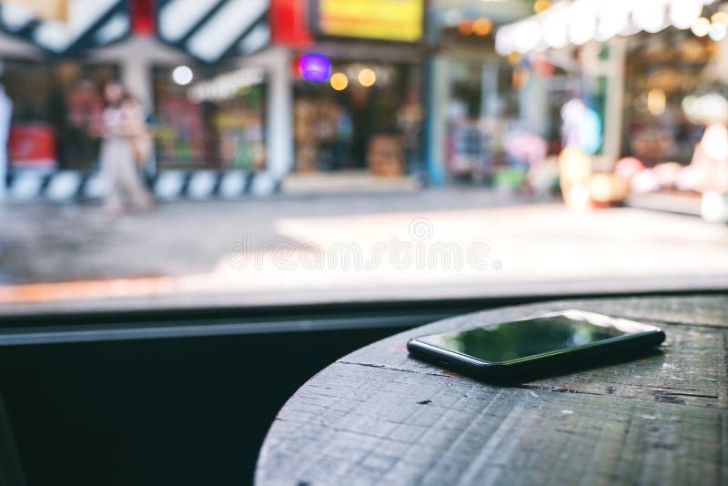 A Mobile Phone on Wooden Table in the Shop Stock Photo - Image of ...
