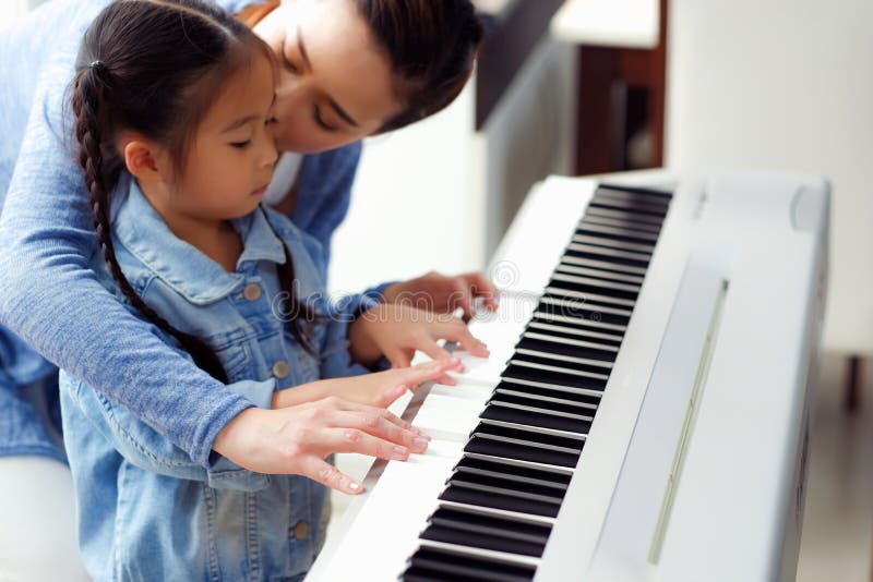 Single Mom and Daughter Playing Music Stock Image - Image of asian ...