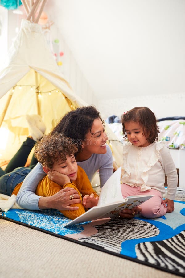 Mother Reading Story To Baby in Nursery Stock Image - Image of ...