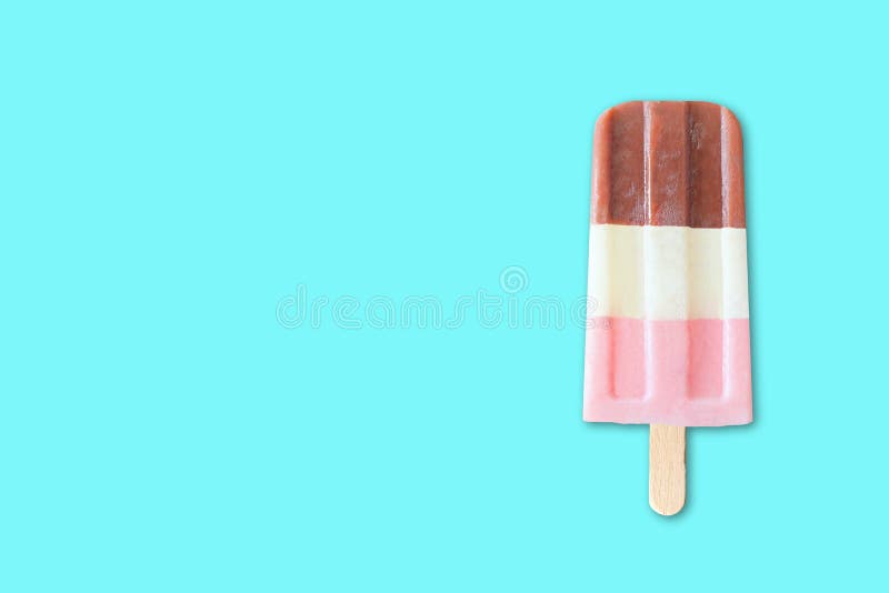 Summer Neapolitan Striped Popsicle Against a Bright Blue Background ...