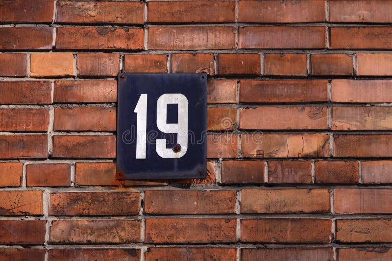 A Single Number Sign Painted on a Brick Wall Stock Image - Image of ...