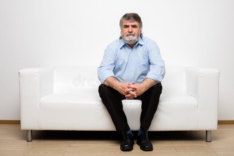 Single Old Men on White Couch Stock Photo - Image of looking, music ...