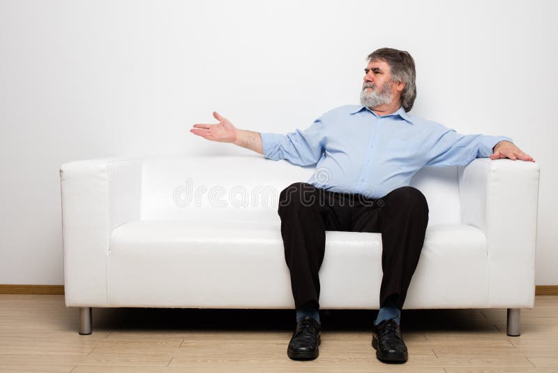 Single Old Men on White Couch Stock Photo - Image of looking, music ...
