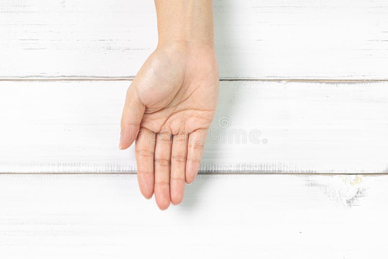 Single Open Hand Facing Upwards on White Wooden Background Stock Image ...