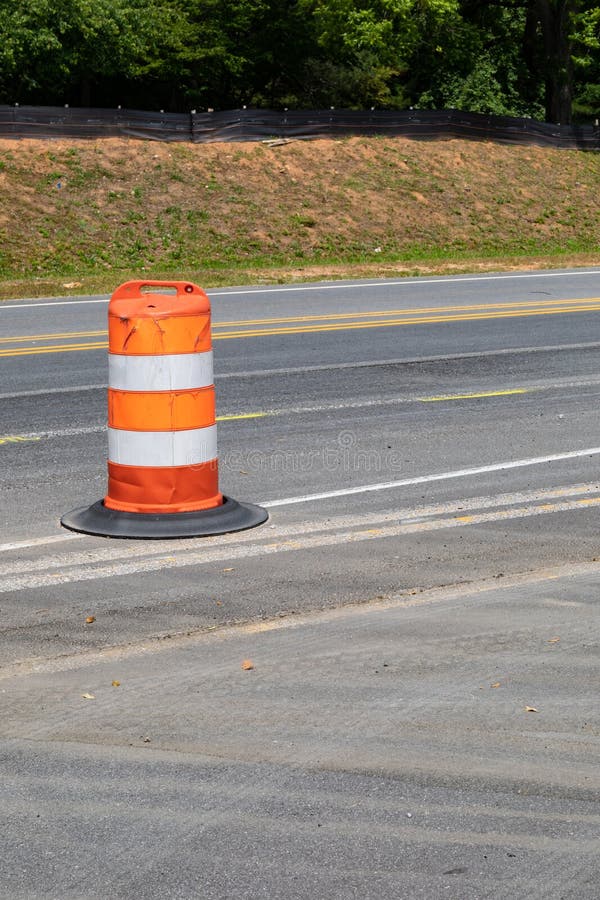 Two Orange and White Traffic Safety Barrels, One Knocked Over, Metaphor ...