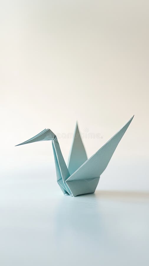 A Single Paper Crane in Pastel Blue, Sitting on a Smooth White Surface ...