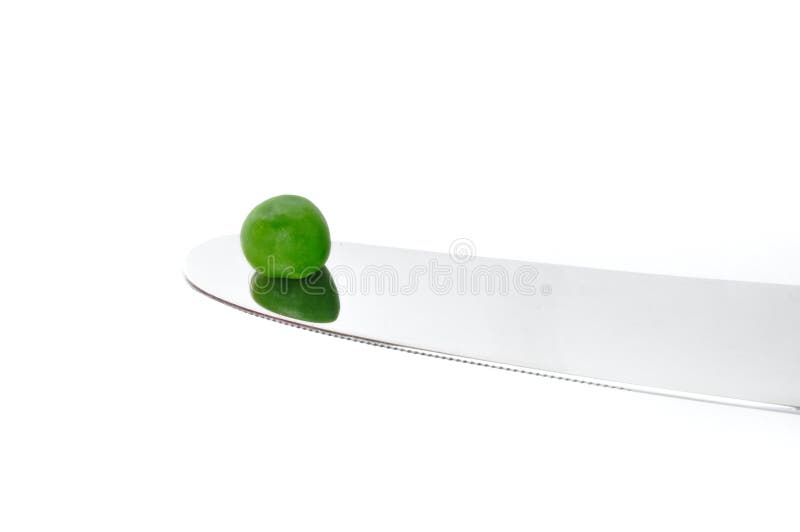 A Single Pea on a Knife stock image. Image of stainless - 23696949