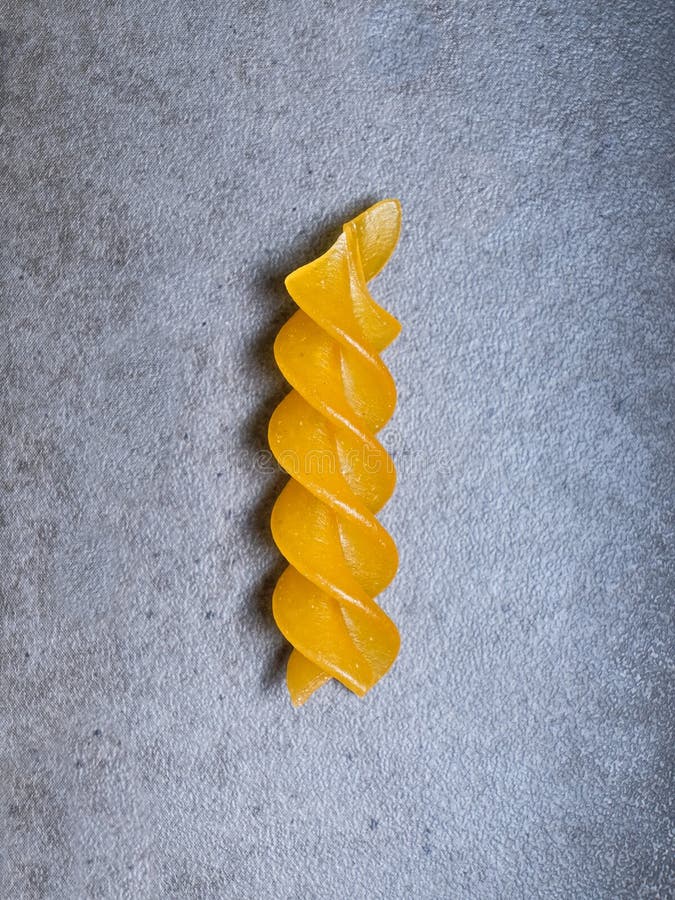 Single Raw Fusilli Pasta on Marble Background Stock Photo - Image of ...