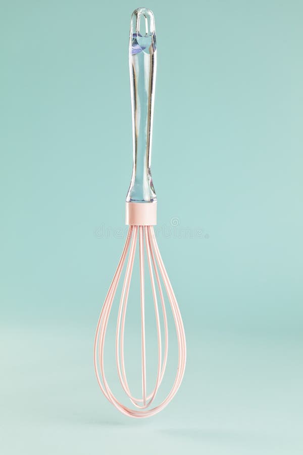 Single Pink Silicone Whisk on Light Blue Background, Vertical ...