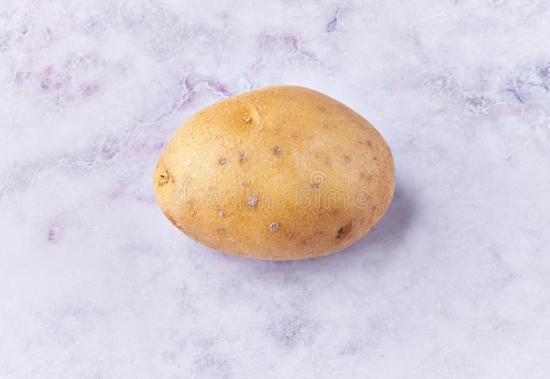 SIngle Potato on a Marble Surface Stock Image - Image of food, surface ...