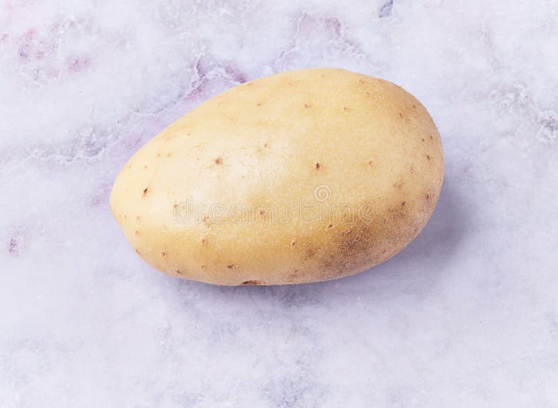 SIngle Potato on a Marble Surface Stock Photo - Image of natural ...