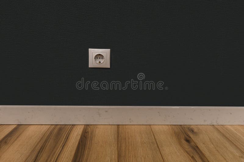 Single Power Socket in Empty Wall Over Wooden Floor Stock Image - Image ...