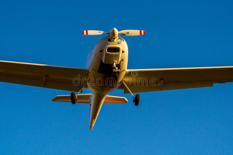 Single-propeller Plane Landing from a Front View at Sunset. Stock Photo ...